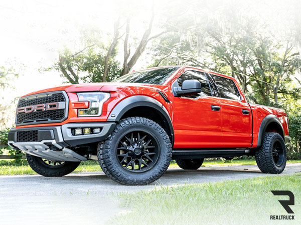 Red Ford Raptor Lifted