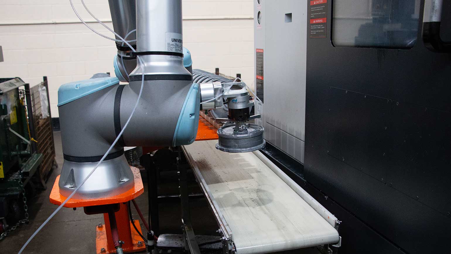 Dual-spindle CNC tending | UR10e at RCM | Cobot Case Stories