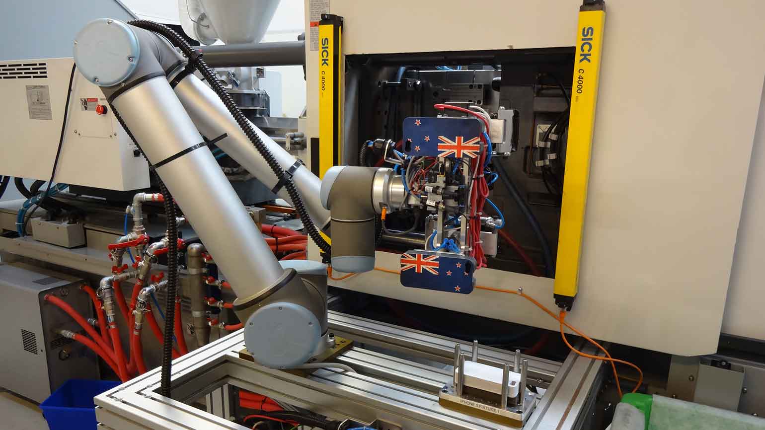 UR10 robots speed up in-mold labelling process