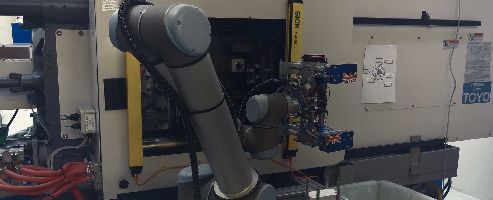 UR10 robots speed up in-mold labelling process