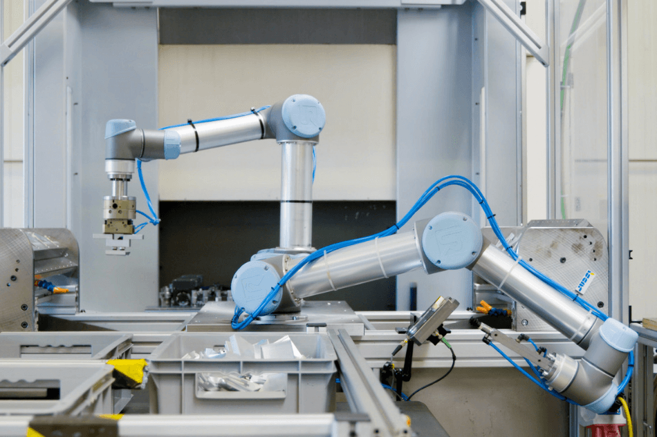 Cobots feed a CNC mill increase quality of parts.