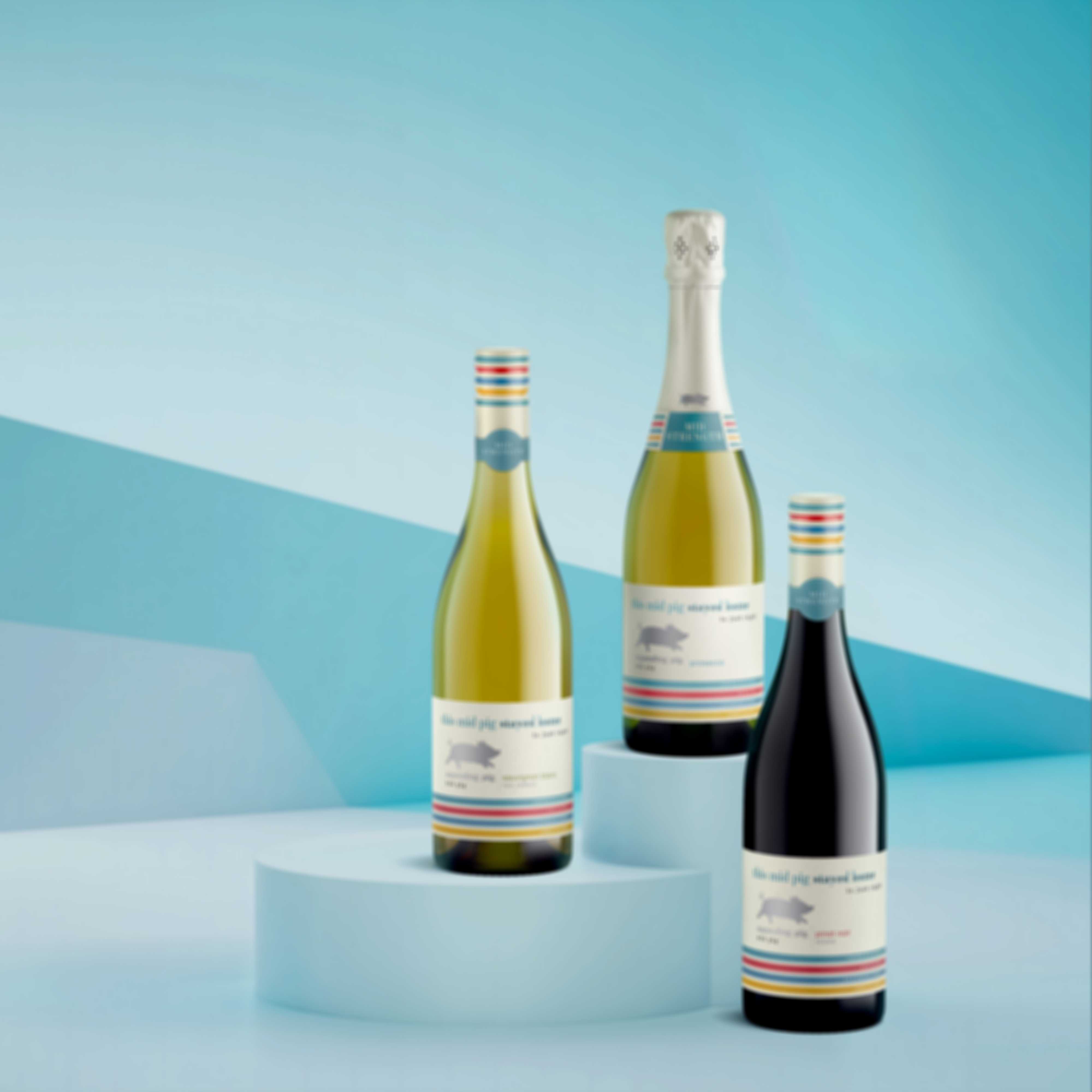 A photo of three bottles of Squealing Pig mid-strength wine sitting on ...